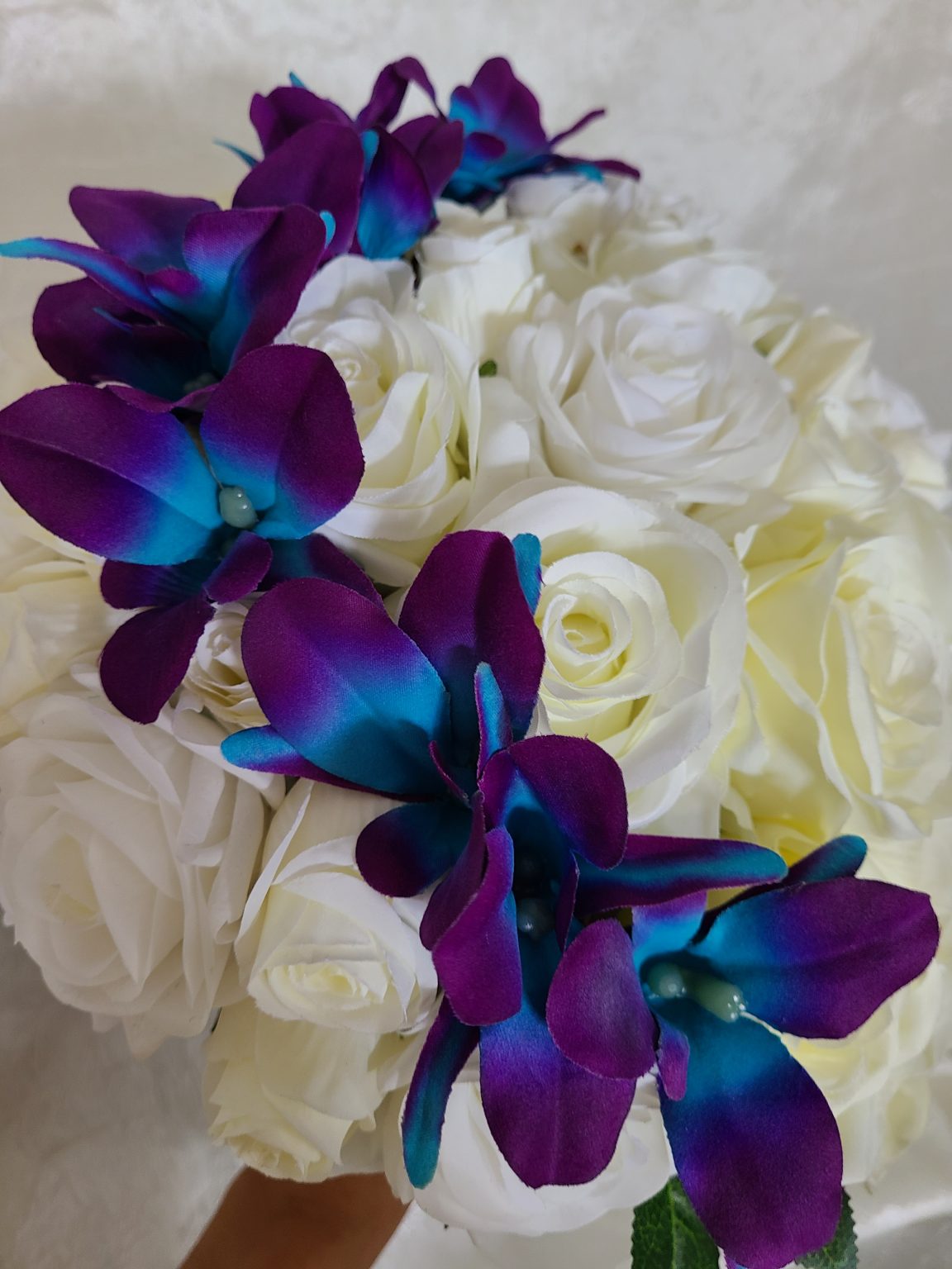 Dress My Wedding – Cascading rose bouquet with orchid accent