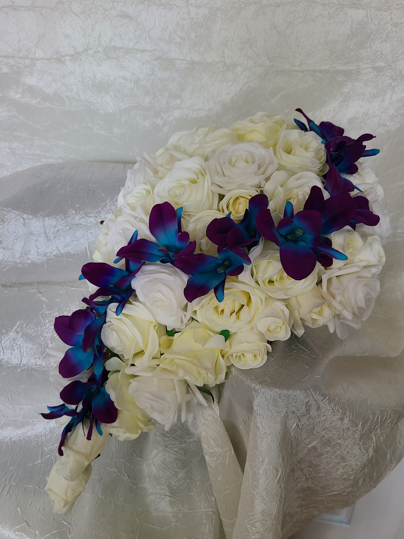 Dress My Wedding – Cascading rose bouquet with orchid accent